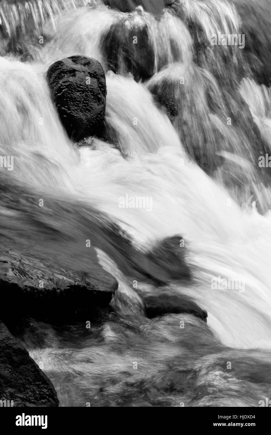Fast flowing mountain stream and rocks Stock Photo - Alamy
