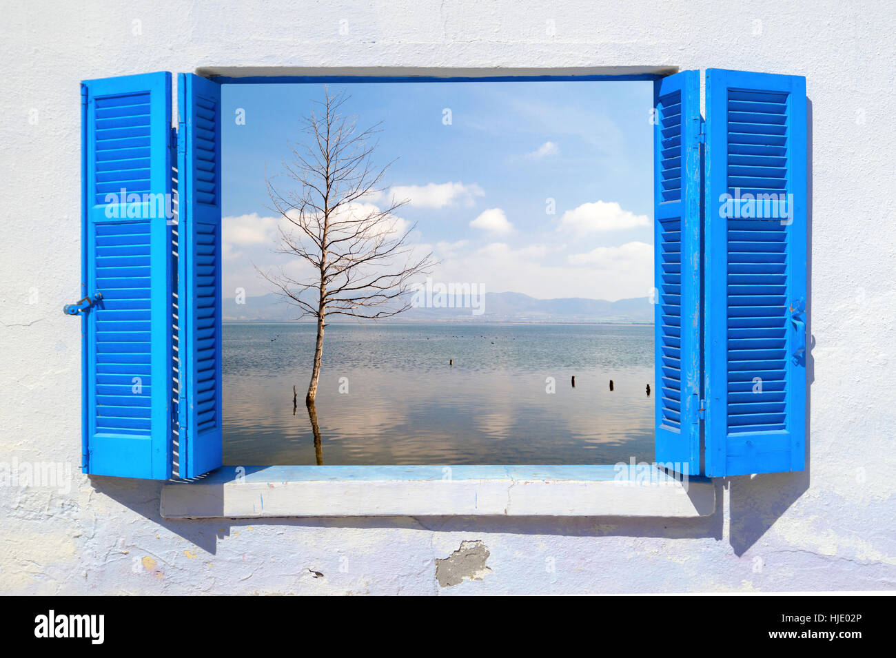Sea view through traditional greek window Stock Photo - Alamy