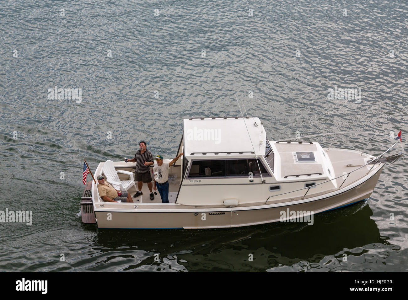 Three Guys on a Boat Stock Photo - Alamy