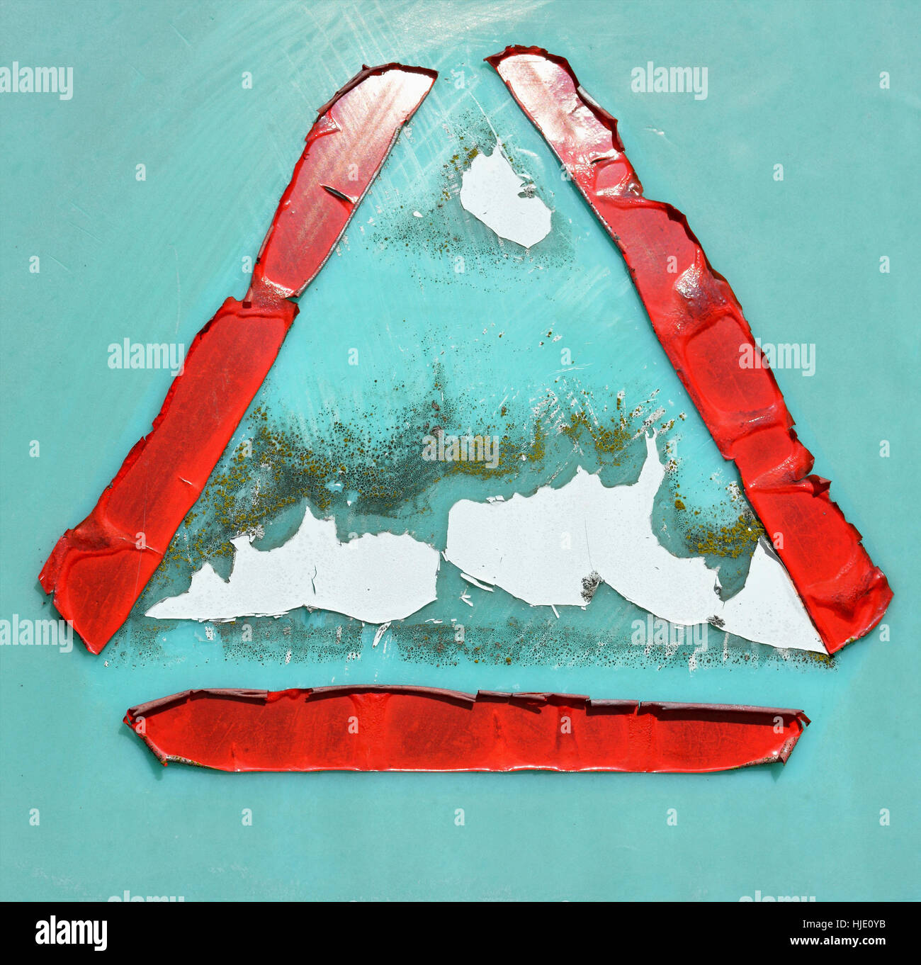 A beat up slow moving triangle on a blue tank Stock Photo - Alamy