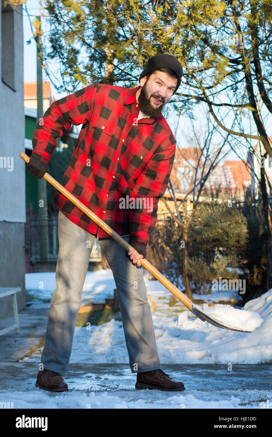Man shoveling snow hi-res stock photography and images - Alamy