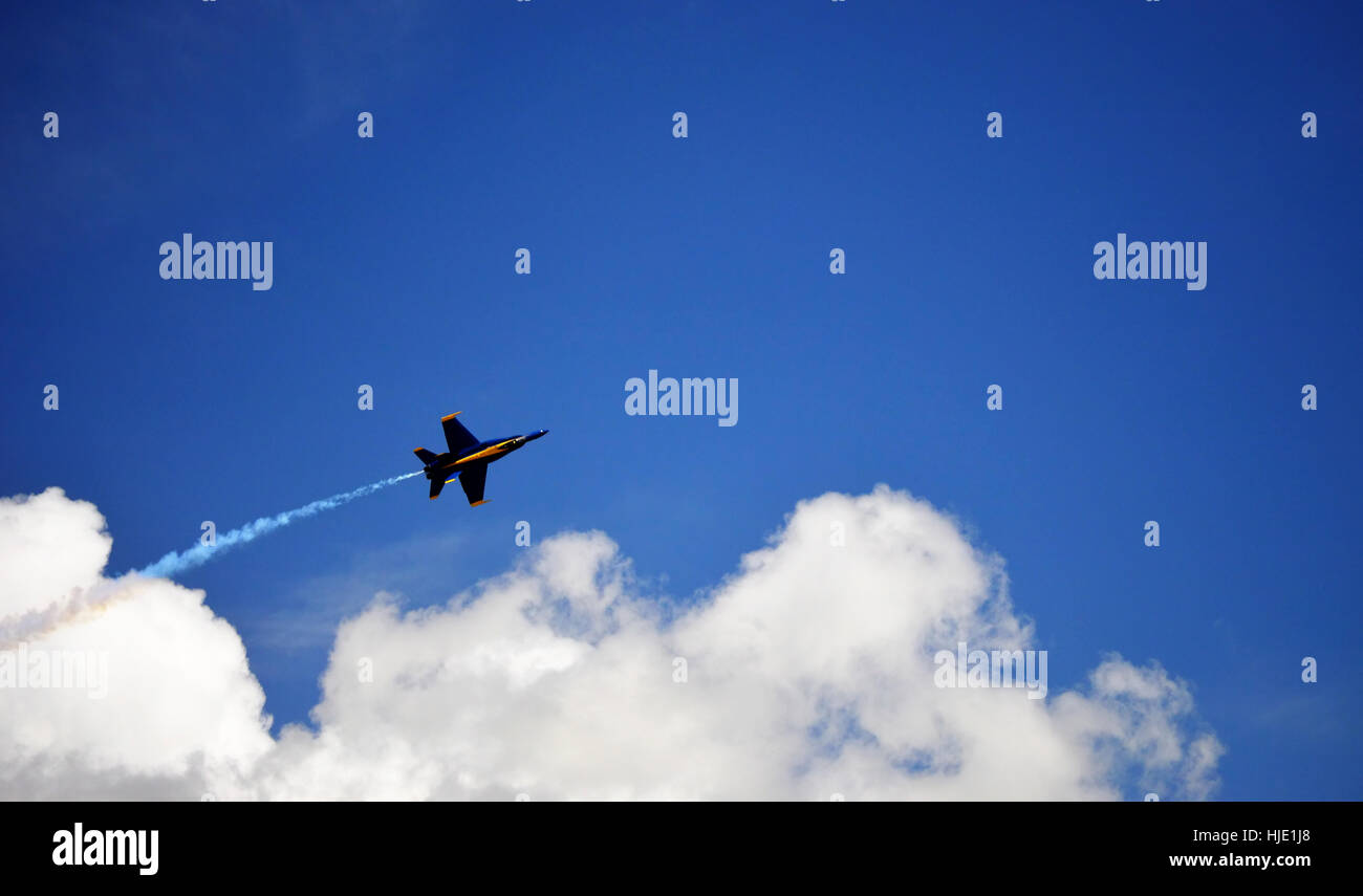 A blue angel jet flying out of a cloud over his home base in Pensacola ...