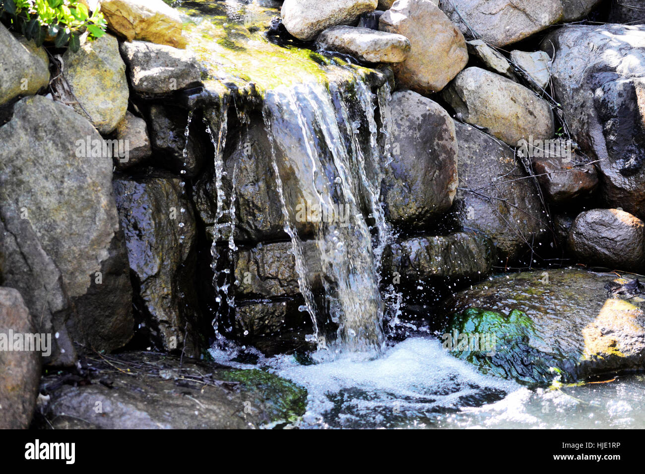 A rocky mini waterfall frozen in action Stock Photo - Alamy