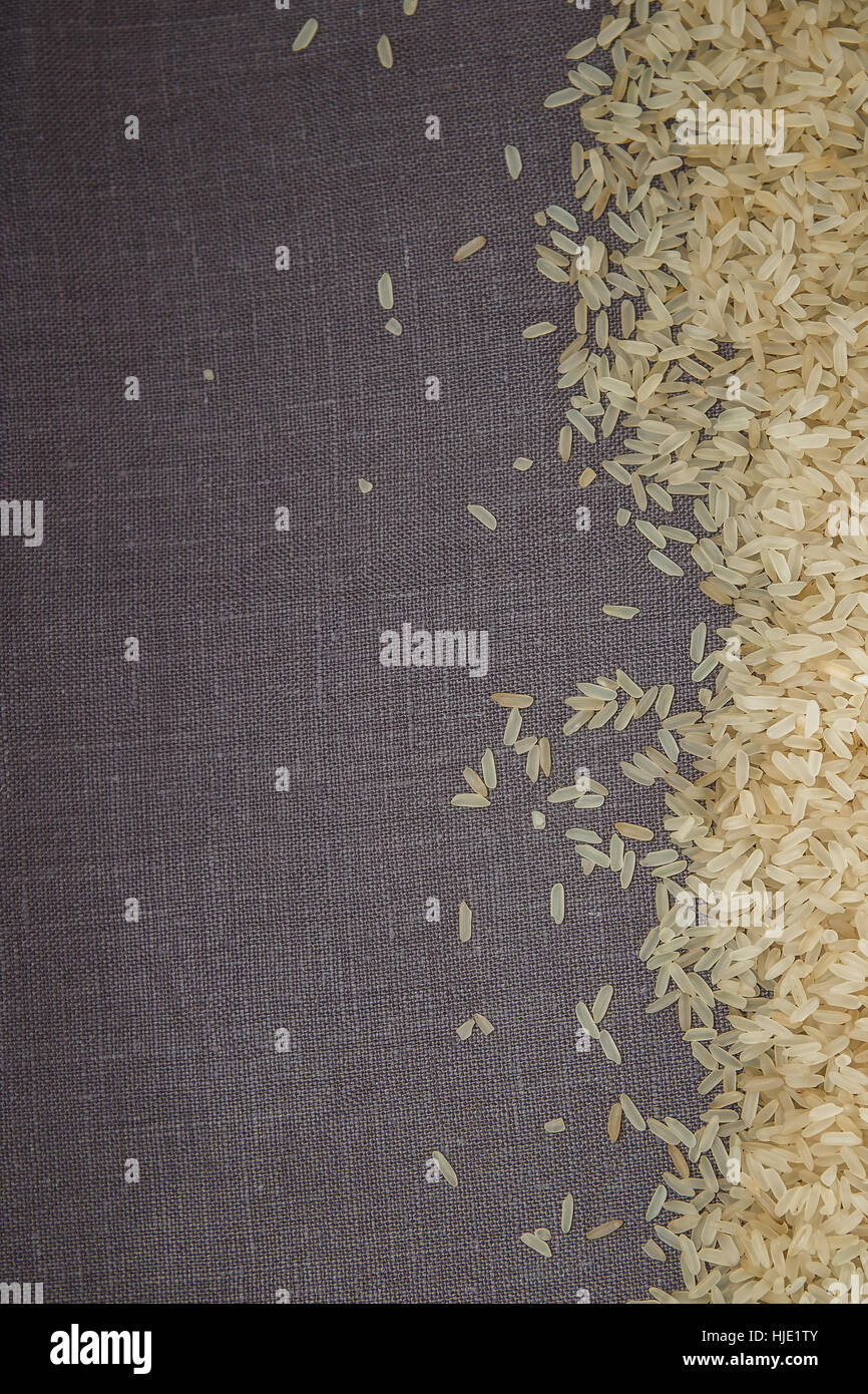Rice on gray background Stock Photo - Alamy