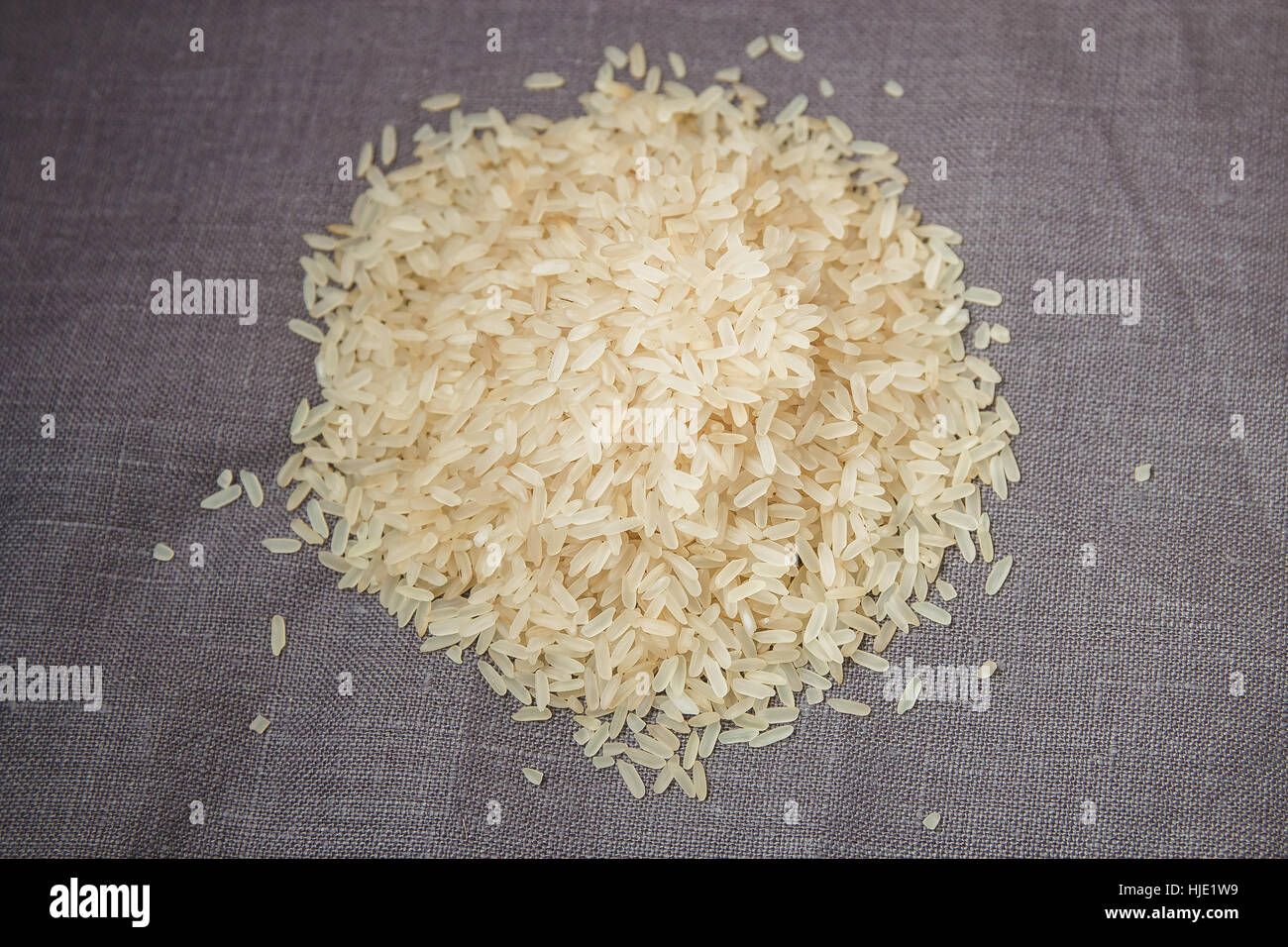Rice on gray background Stock Photo - Alamy