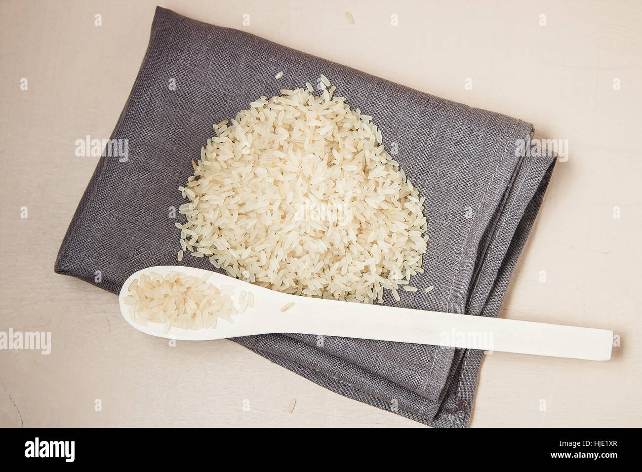 wooden spoon with white rice Stock Photo - Alamy