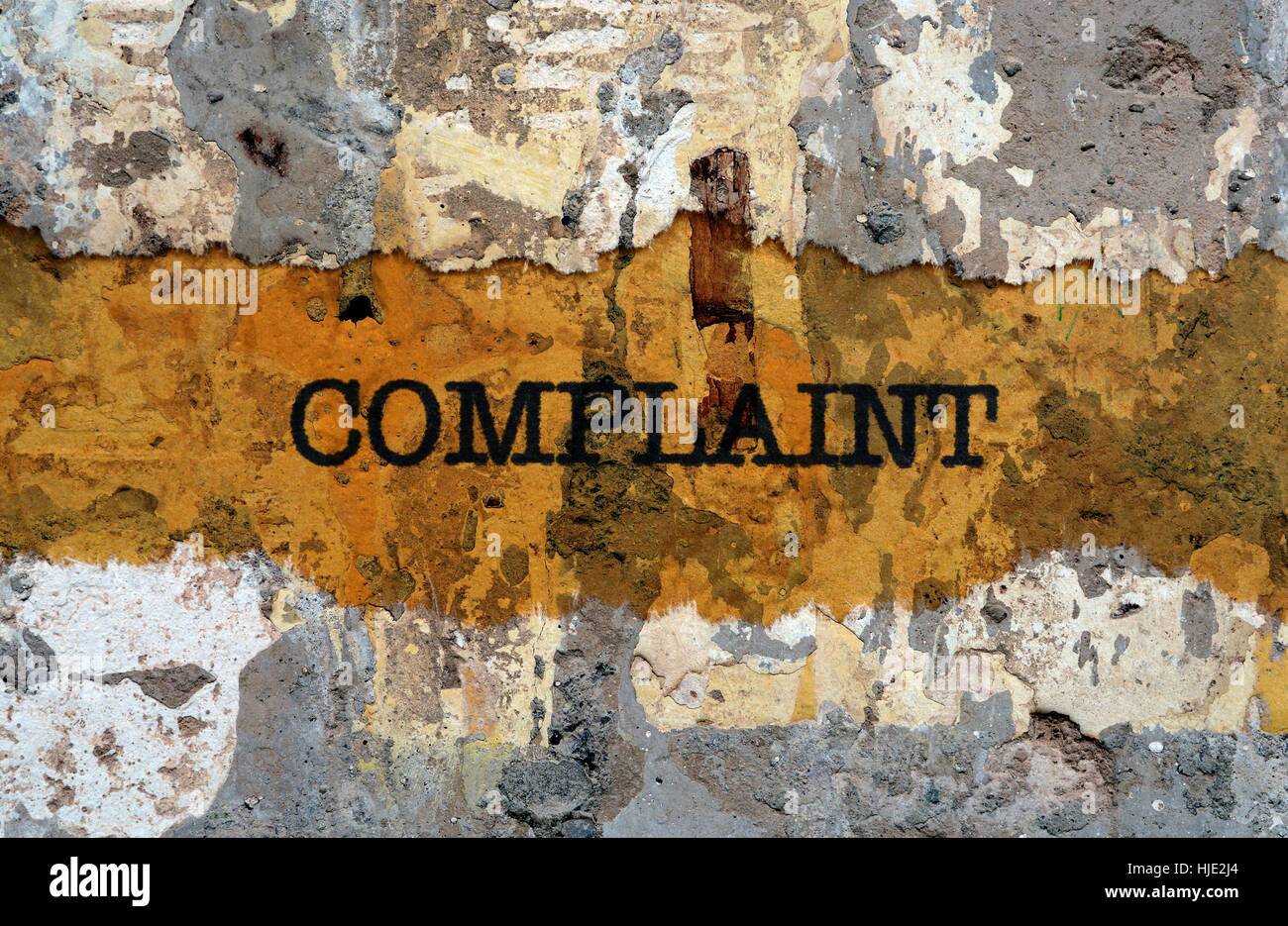 Complaint text on wall Stock Photo - Alamy