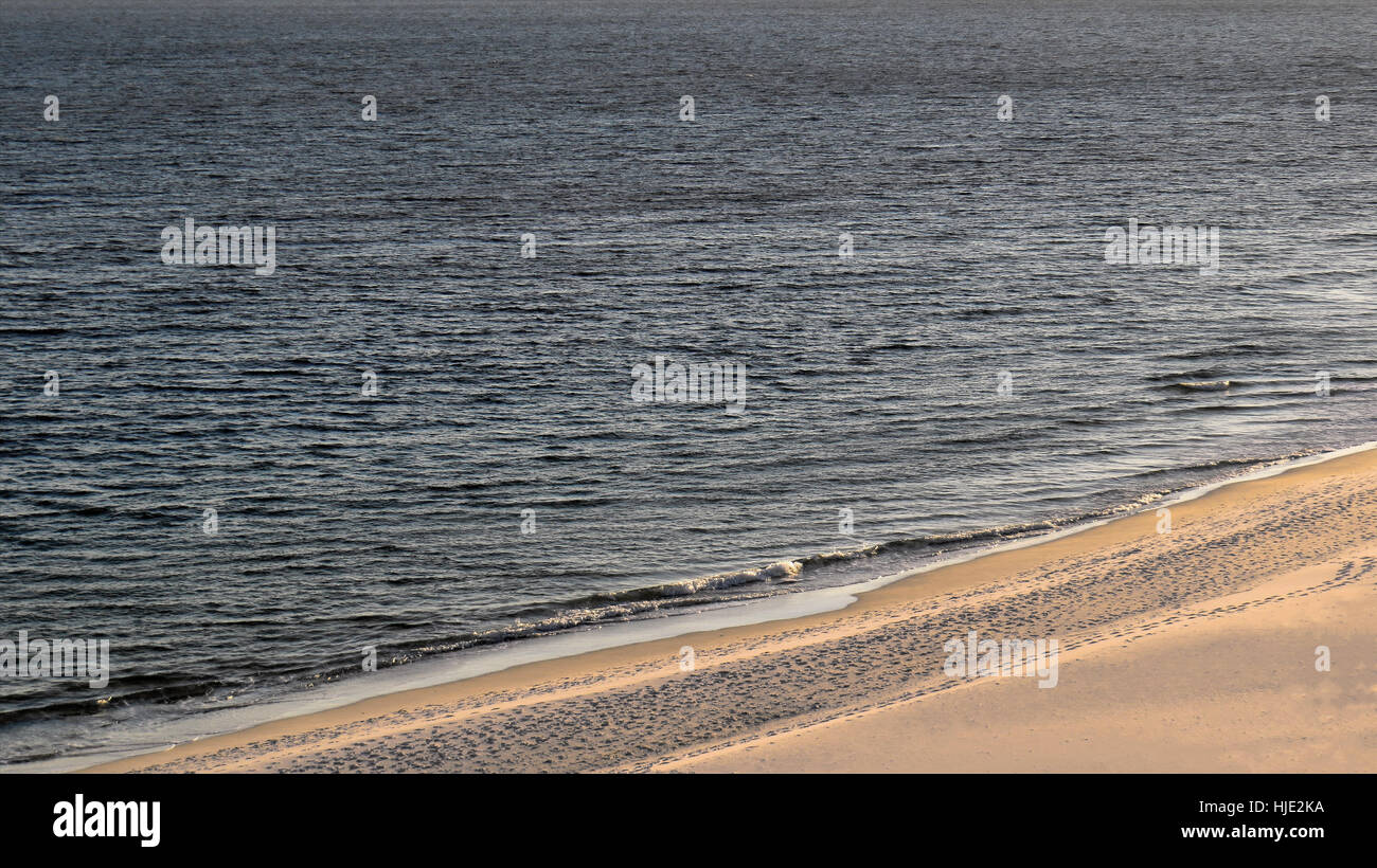 Ocean waves coming in at evening Stock Photo - Alamy