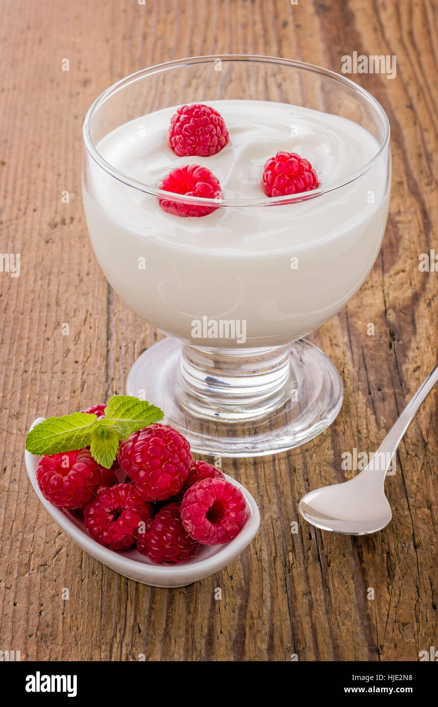fresh creamy natural yoghurt with raspberries Stock Photo - Alamy