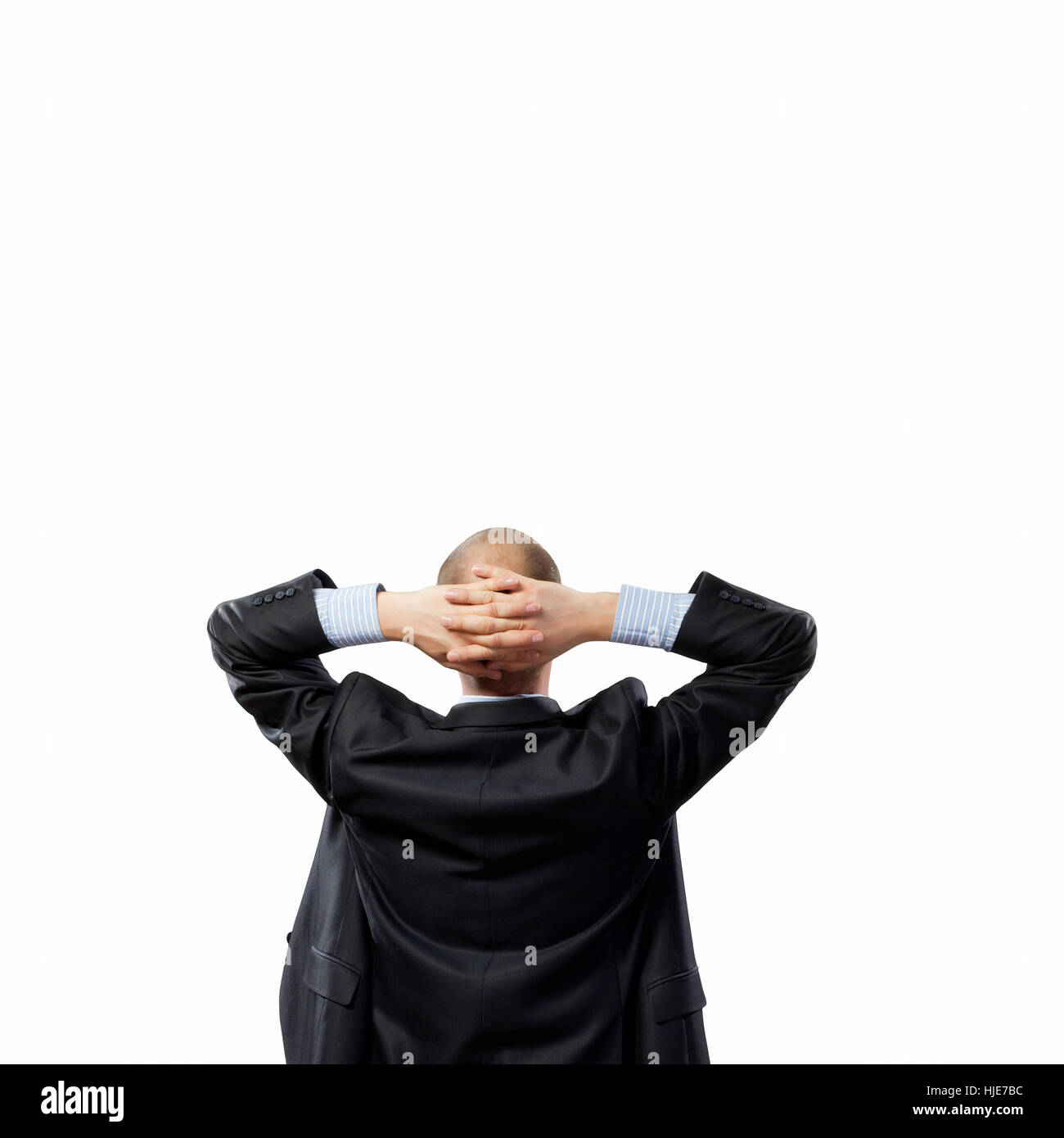 Back view image of businessman with arms crossed behind head. Place for ...
