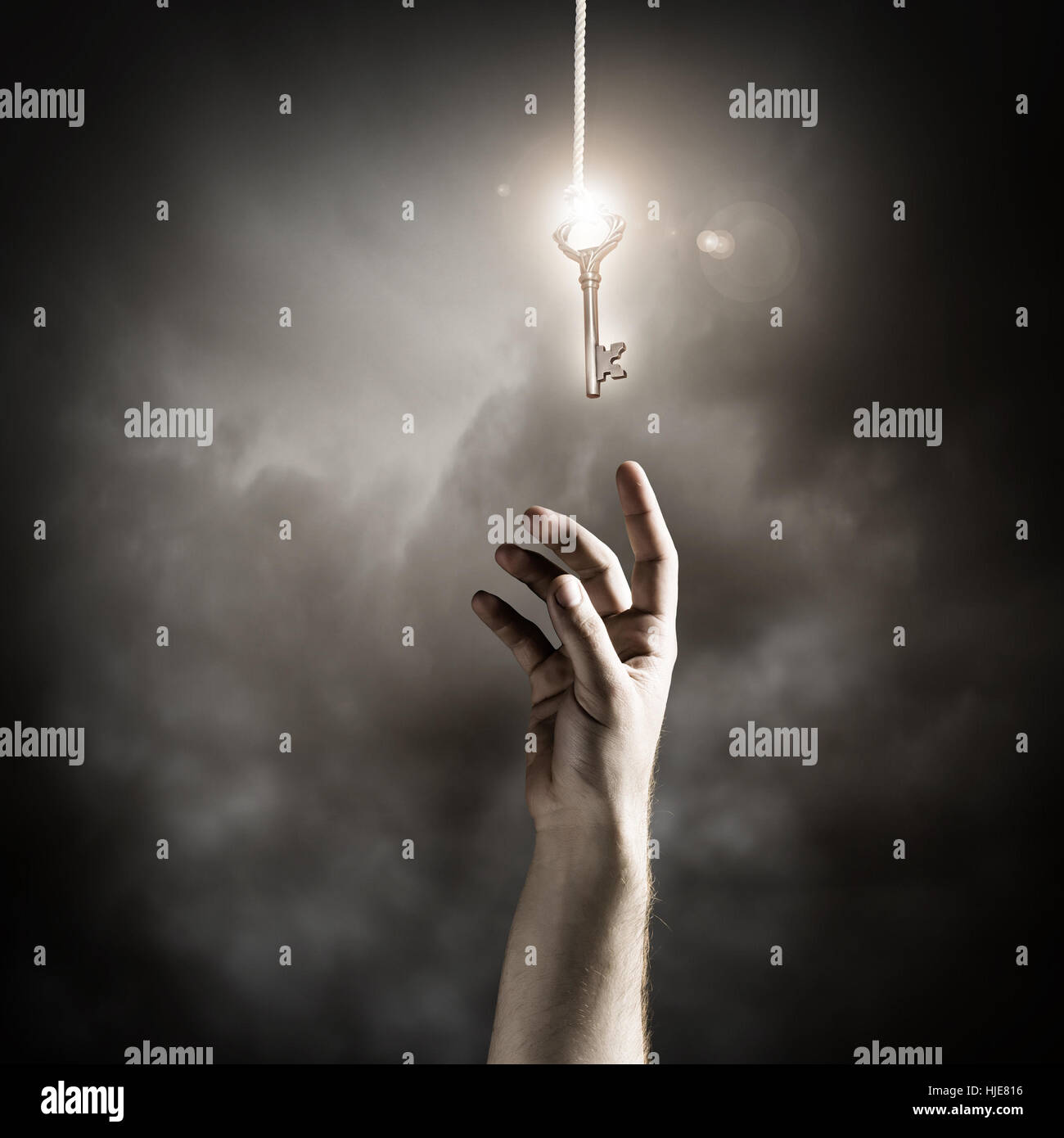 Close up of human hand holding key Stock Photo - Alamy