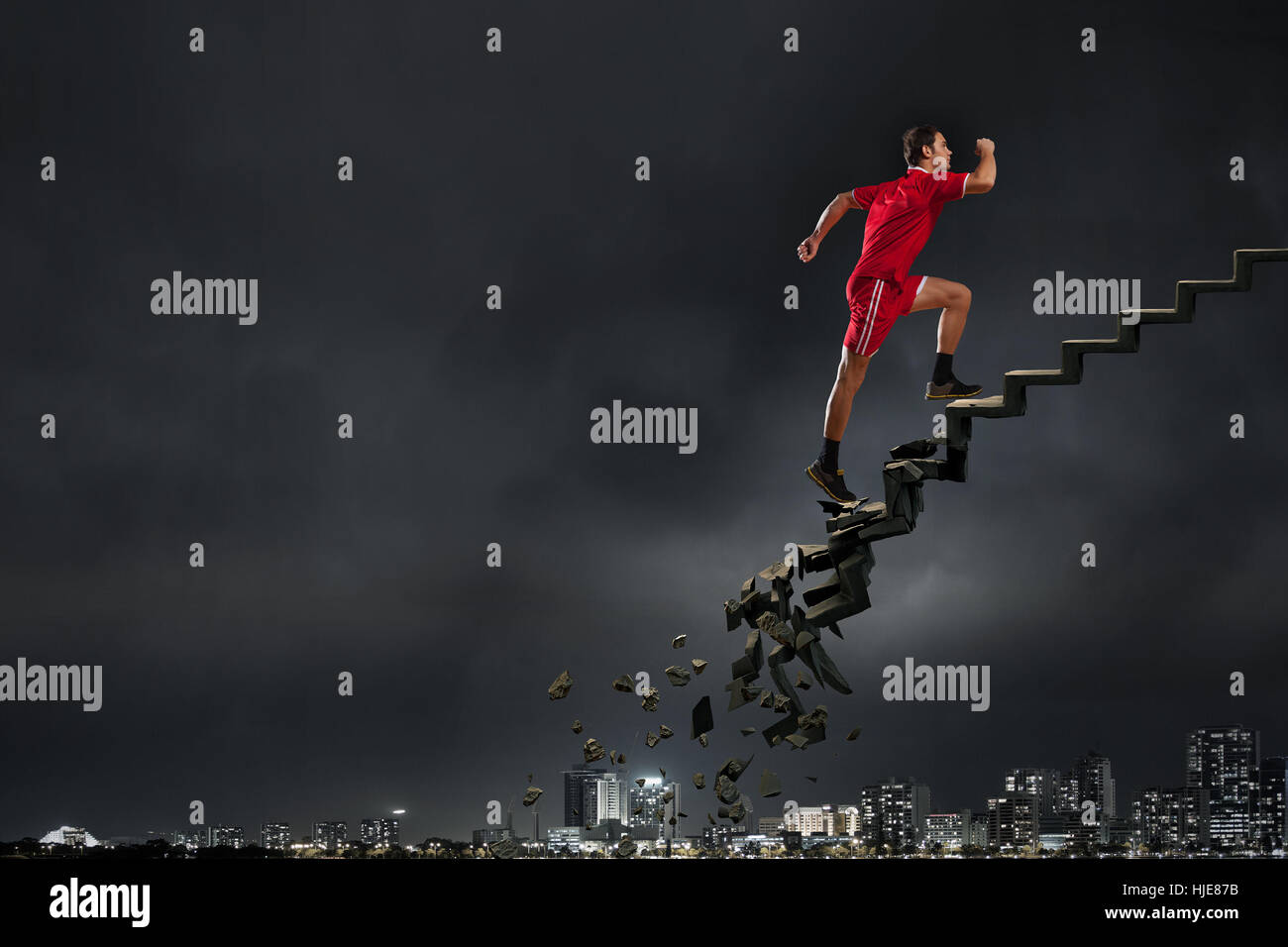 Sports active man running on stone collapsing ladder Stock Photo - Alamy