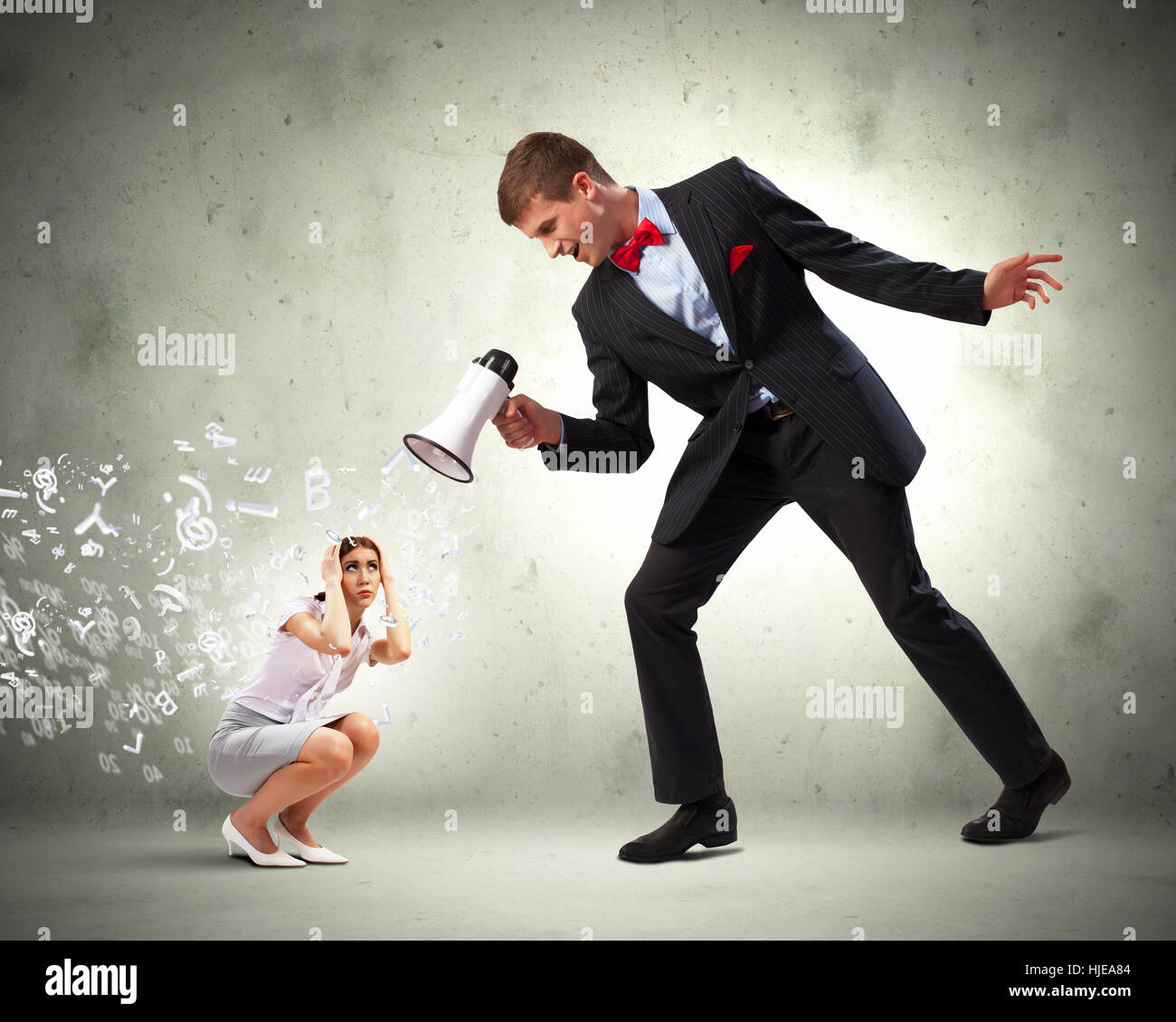 Angry businessman with megaphone shouting at colleague hi-res stock ...