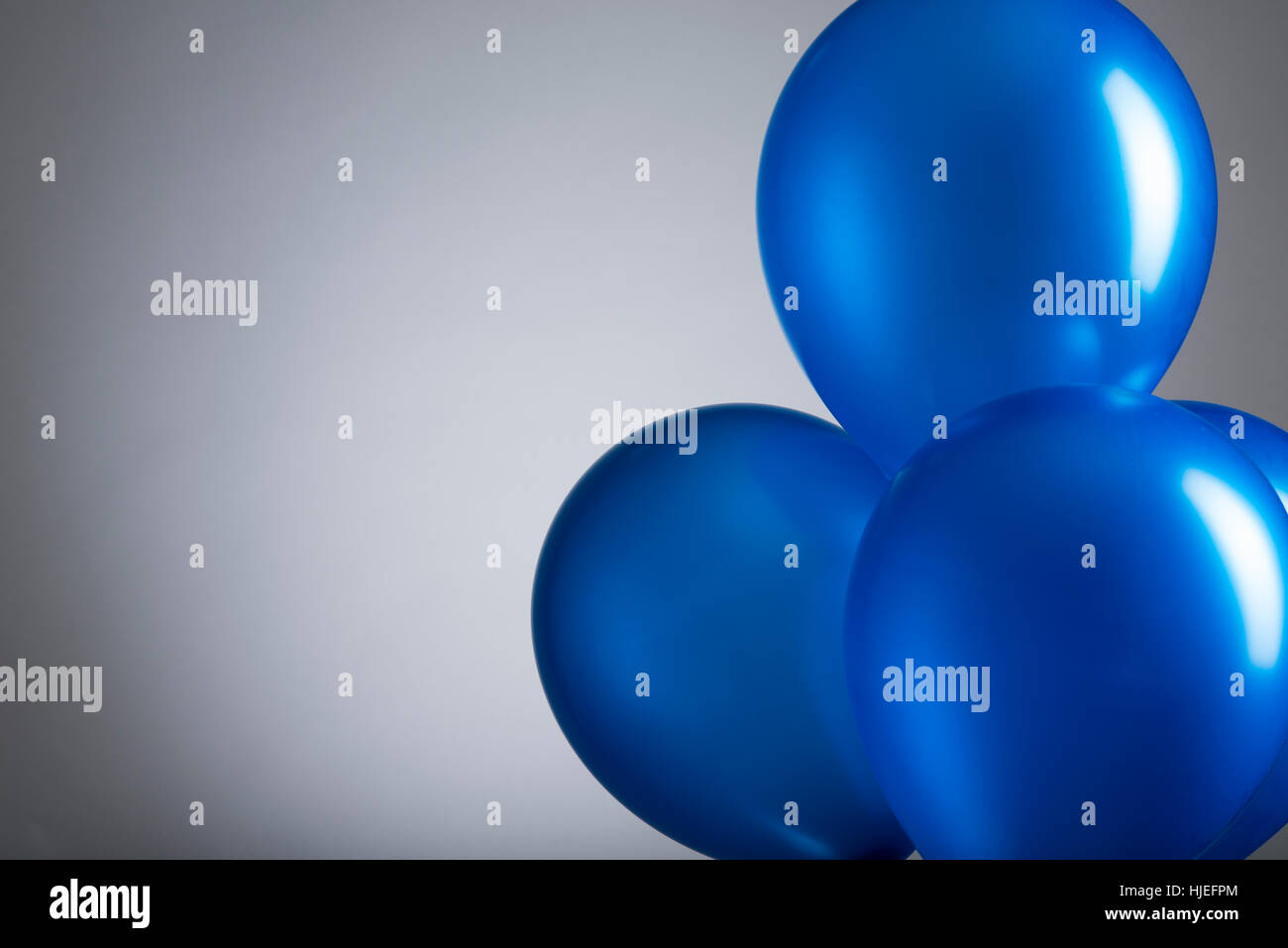 Blue party balloons on graduated background Stock Photo - Alamy