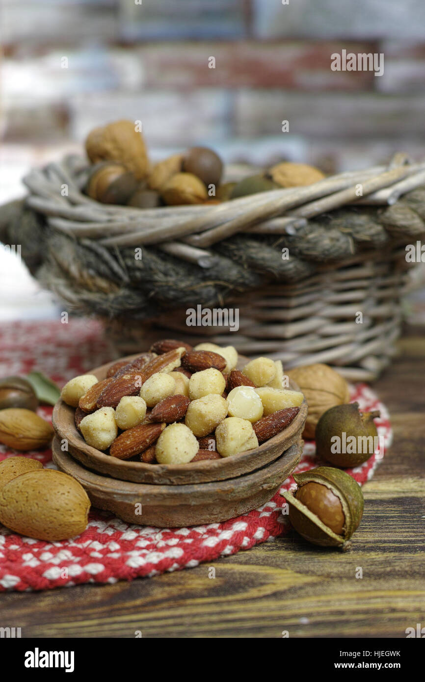 Roasted salted nuts mix, snack from macadamia, walnotes and almonds and ...
