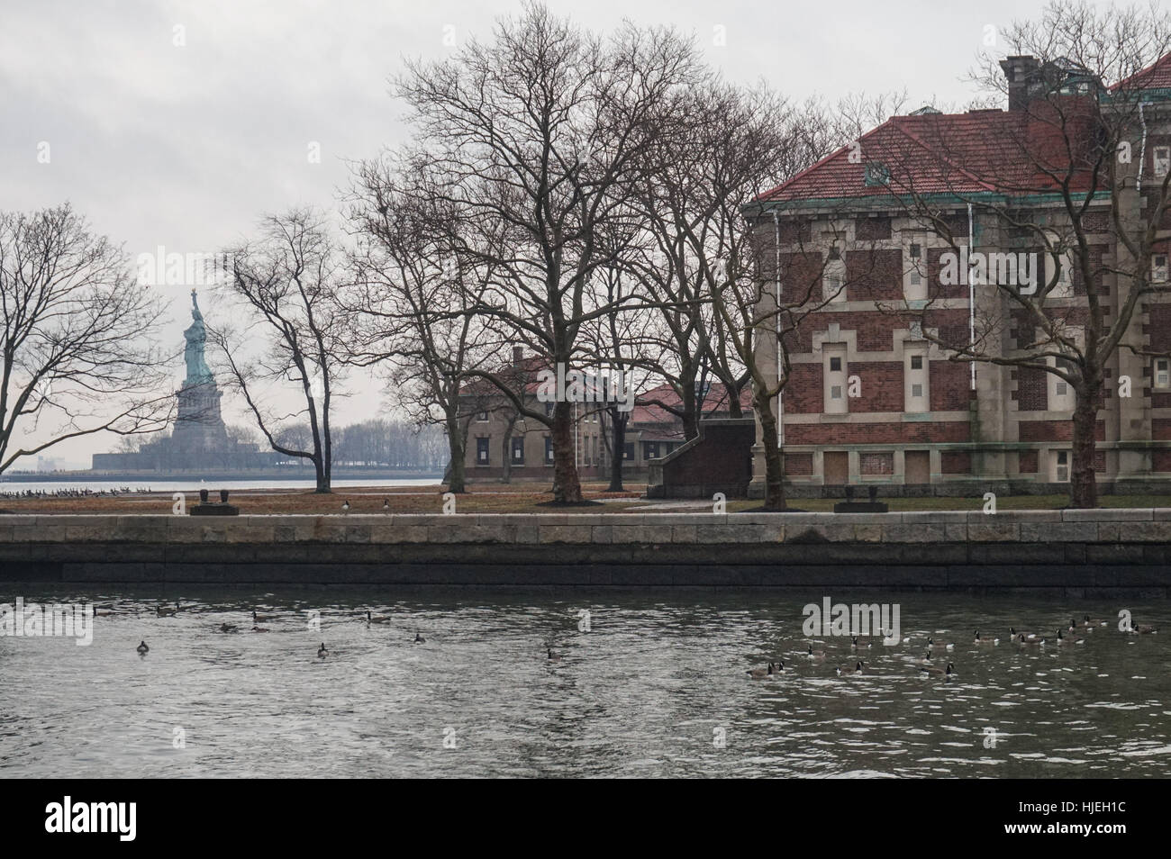 Ellis Island Immigration Museum with the Statue of Liberty behind, New ...