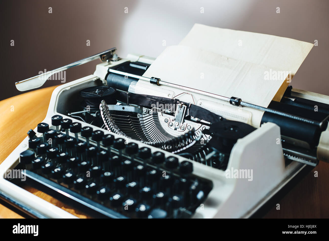 Retro old typewriter with paper sheet Stock Photo - Alamy