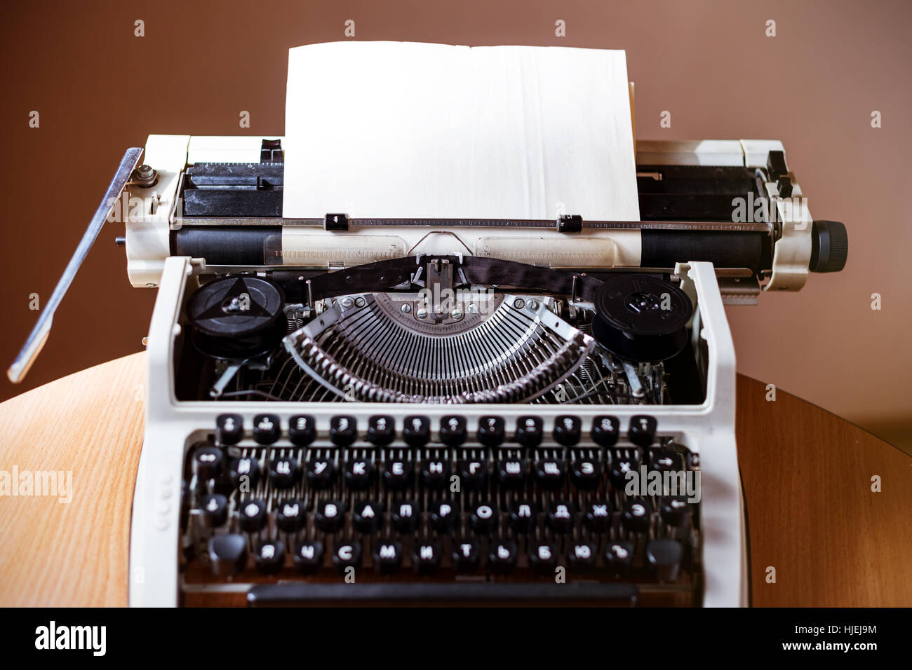 Retro old typewriter with paper sheet Stock Photo - Alamy
