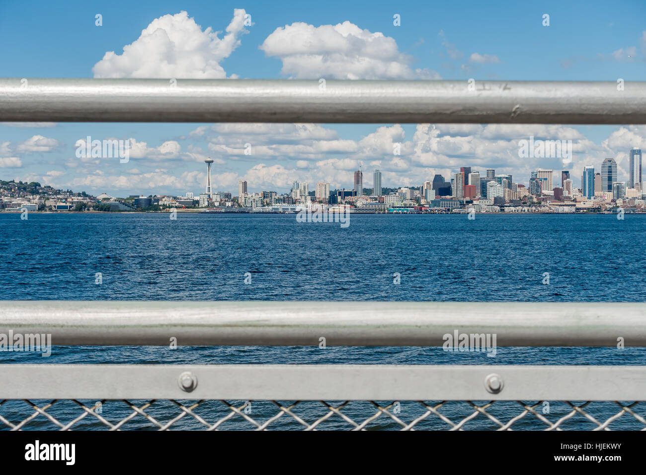 White puffy clouds hover over the Seattle skyline on a sunny day Stock ...