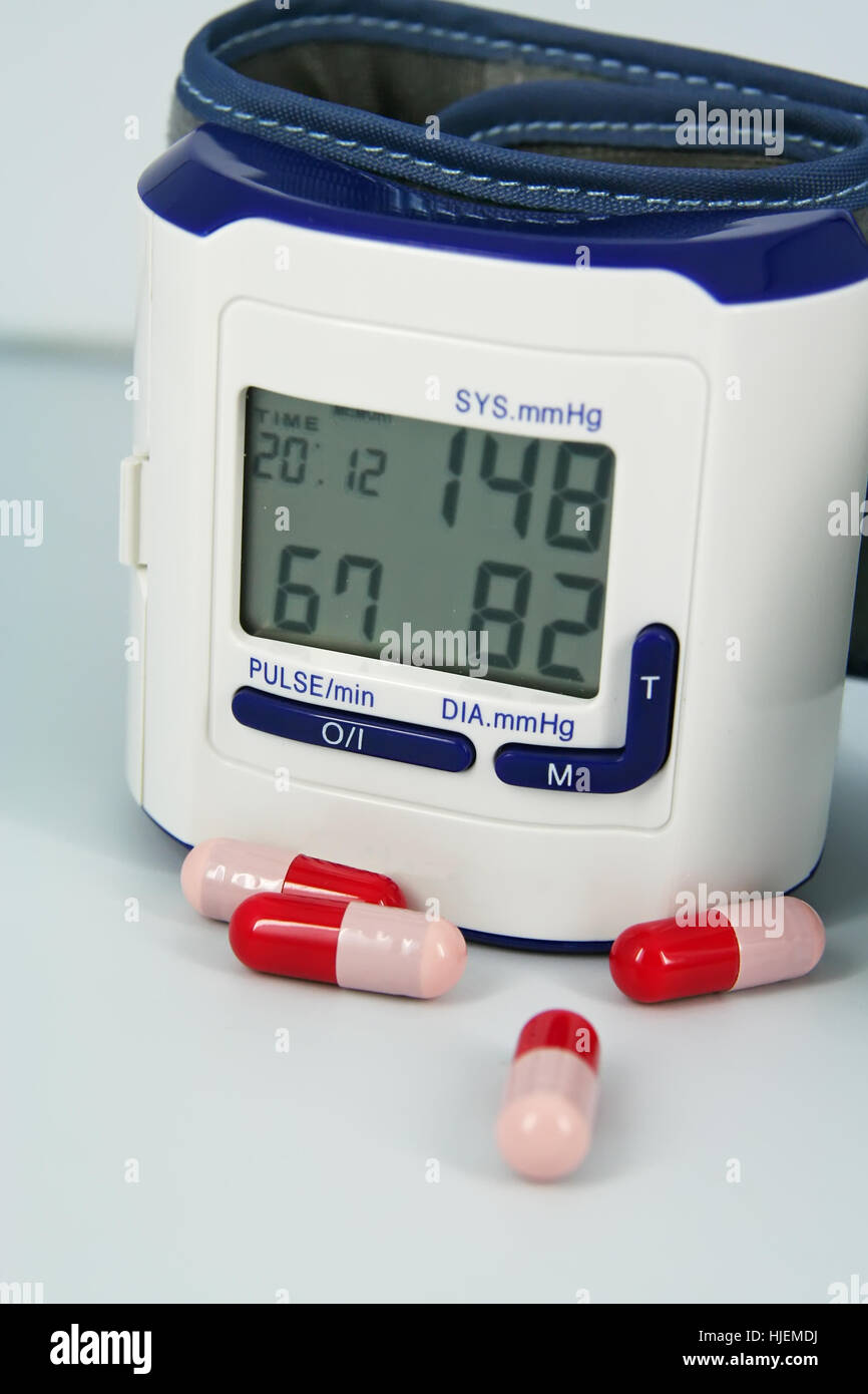 Blood pressure monitor. Medical measure instrument and pills Stock ...