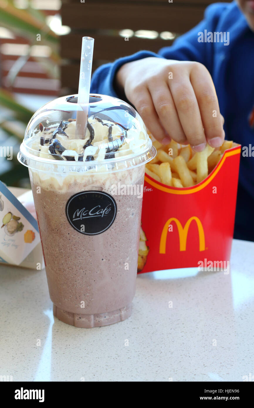 Close up of McDonald's chocolate Frappe and potato chips in McDonald's ...