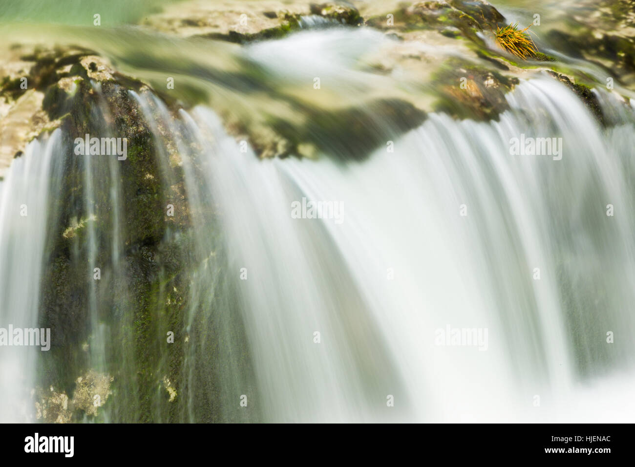 A close up view of cascading water falling over the rocks Stock Photo ...