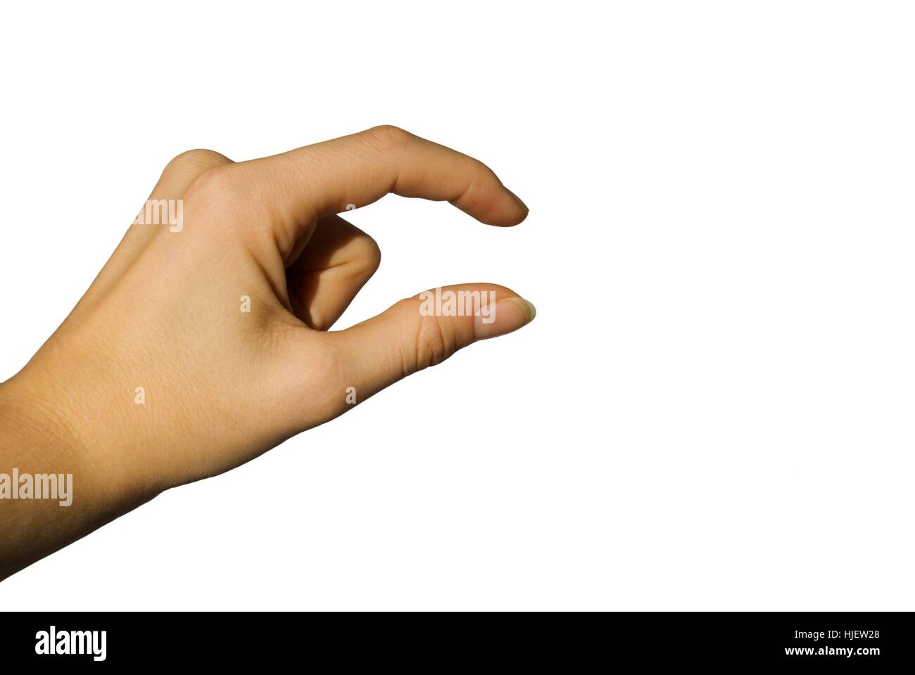 a hand showing something little, on white Stock Photo - Alamy
