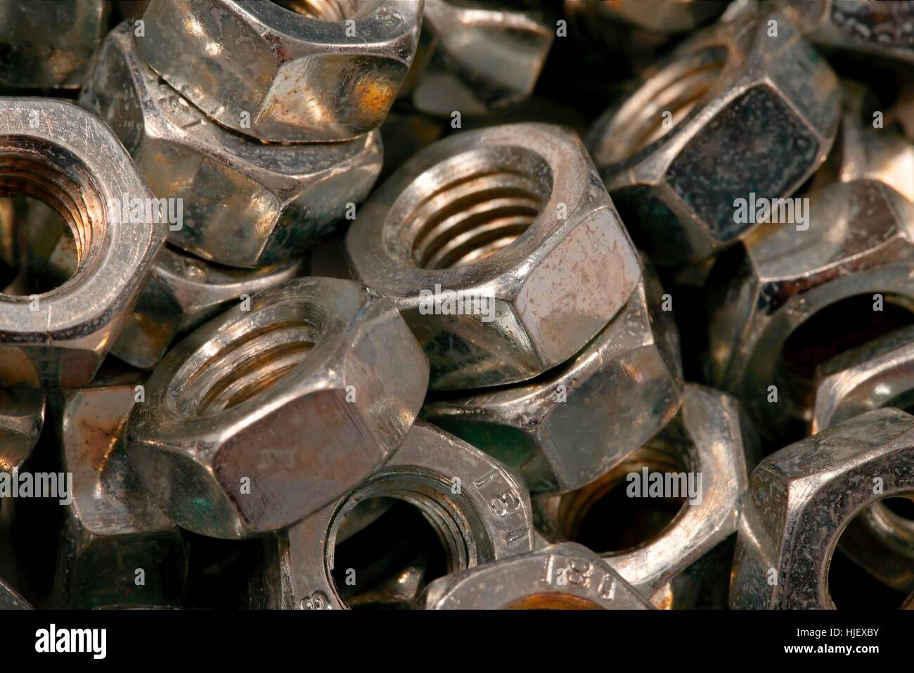 A pile of metal nuts Stock Photo - Alamy