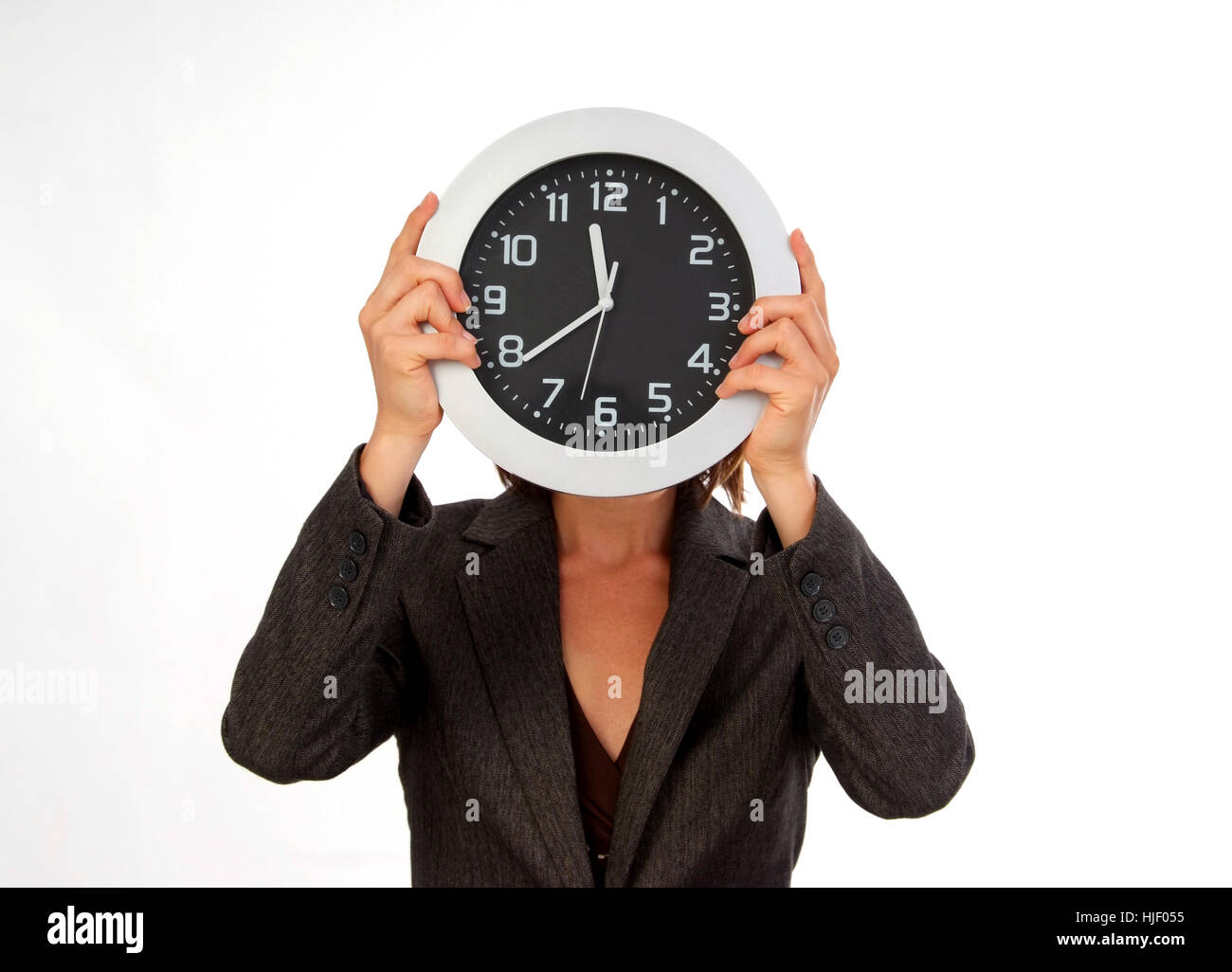 Woman with clock head Stock Photo - Alamy