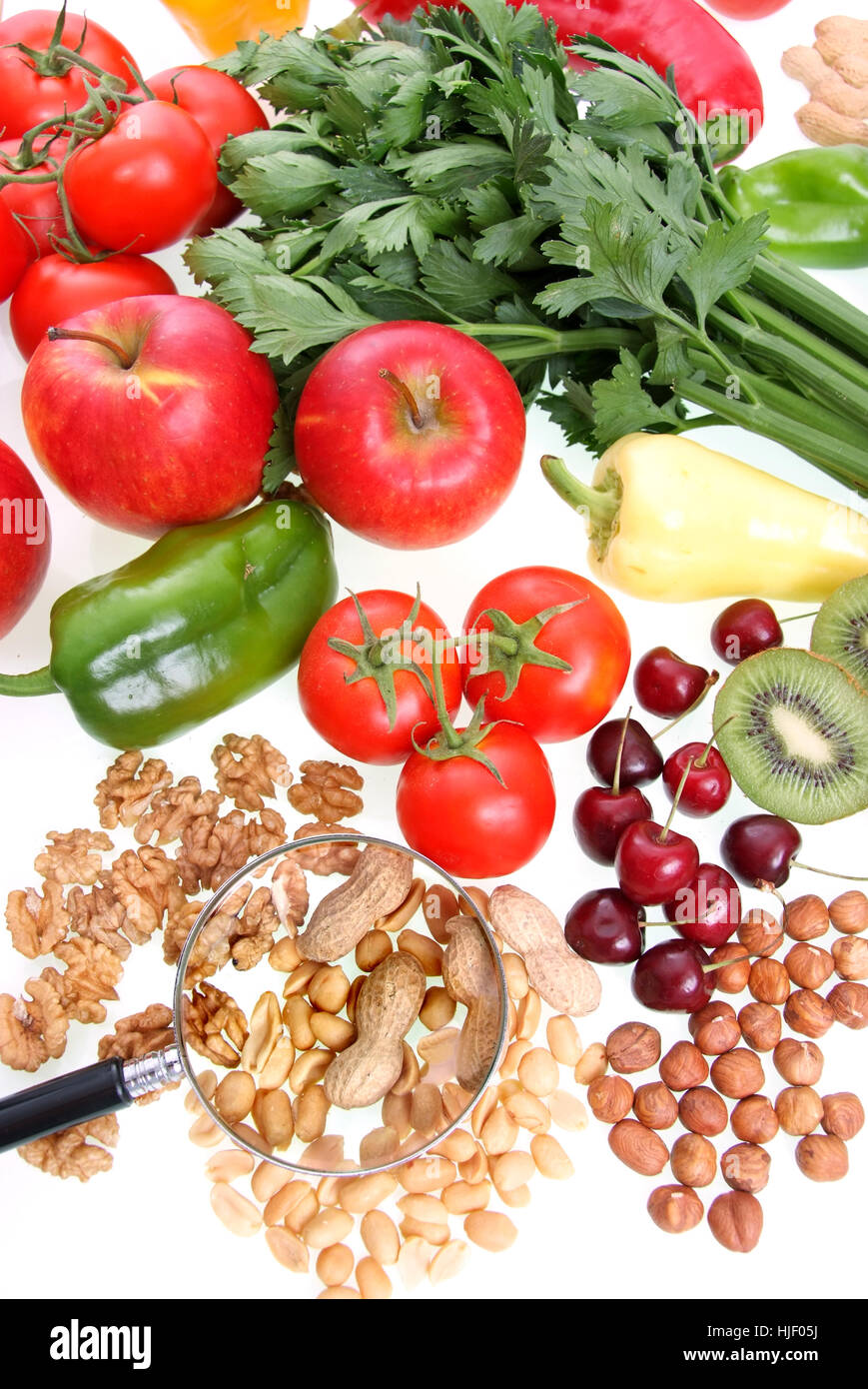 Fruits, vegetables and nuts under magnifier Stock Photo - Alamy