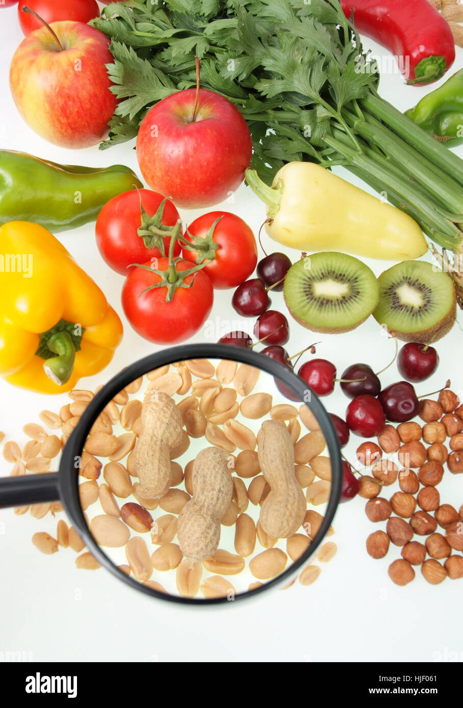 Fruits, vegetables and nuts under magnifier Stock Photo - Alamy
