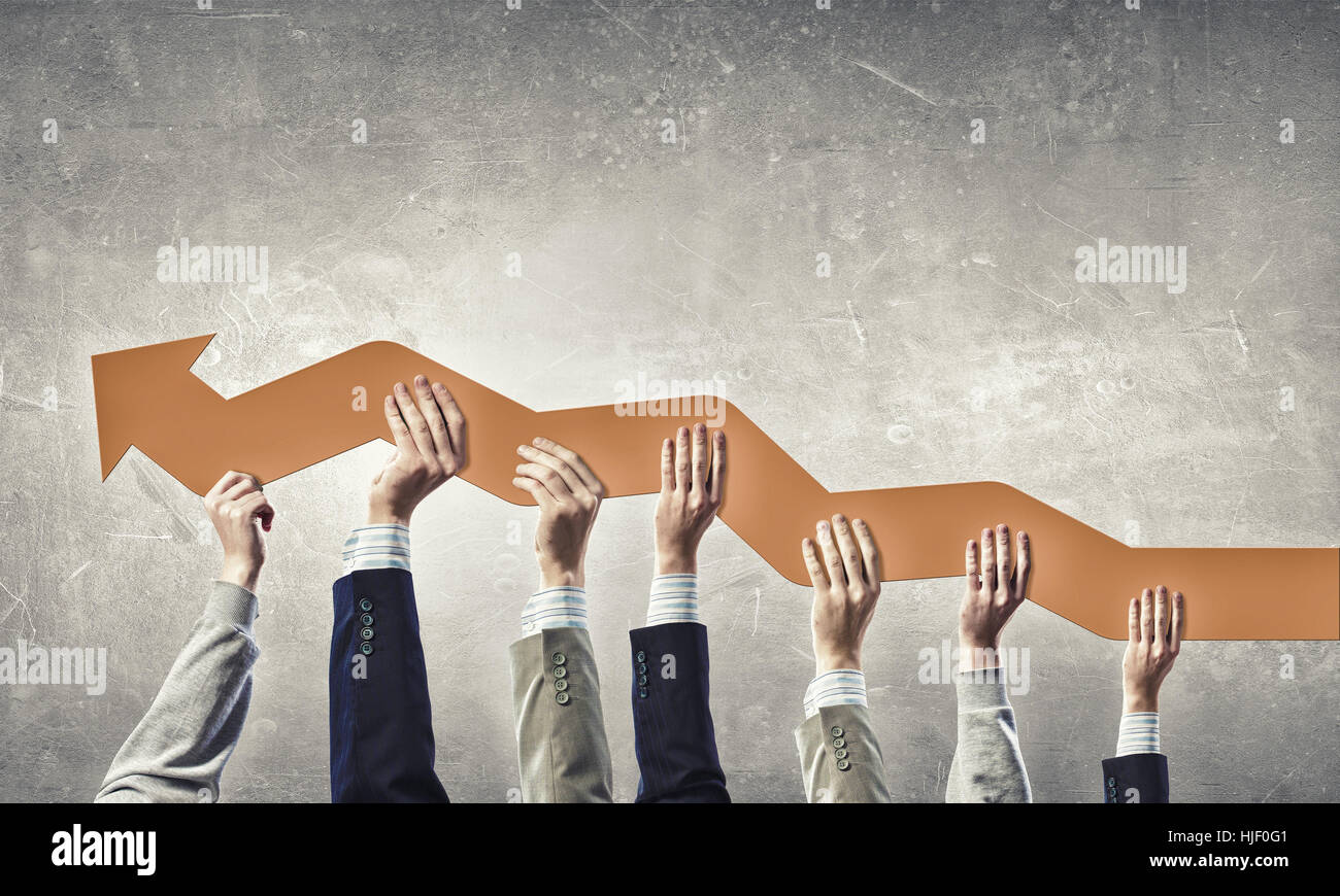 Group of business people holding growing graph in raised hands Stock ...