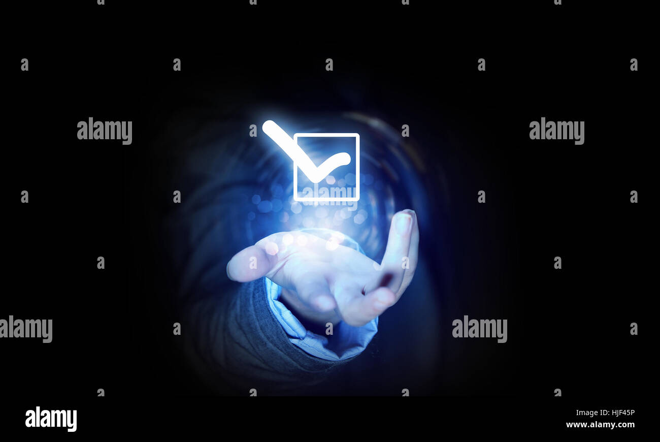 Close up of businessman's hand holding check mark icon in palm Stock ...