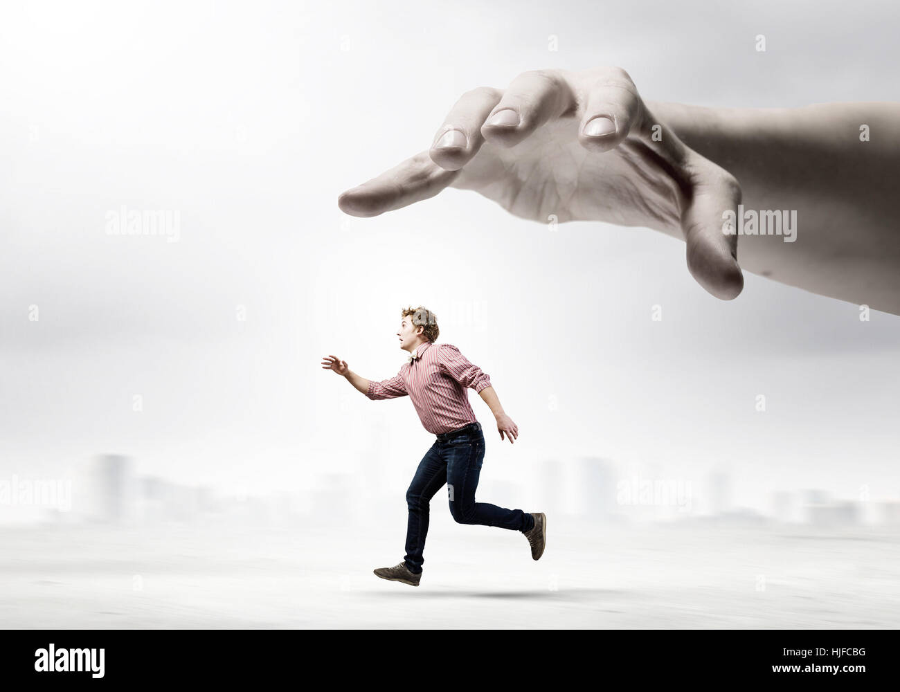 Man running away scared looking hi-res stock photography and images - Alamy
