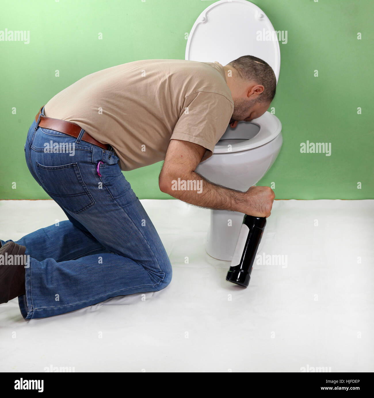 Man vomiting toilet hi-res stock photography and images - Alamy