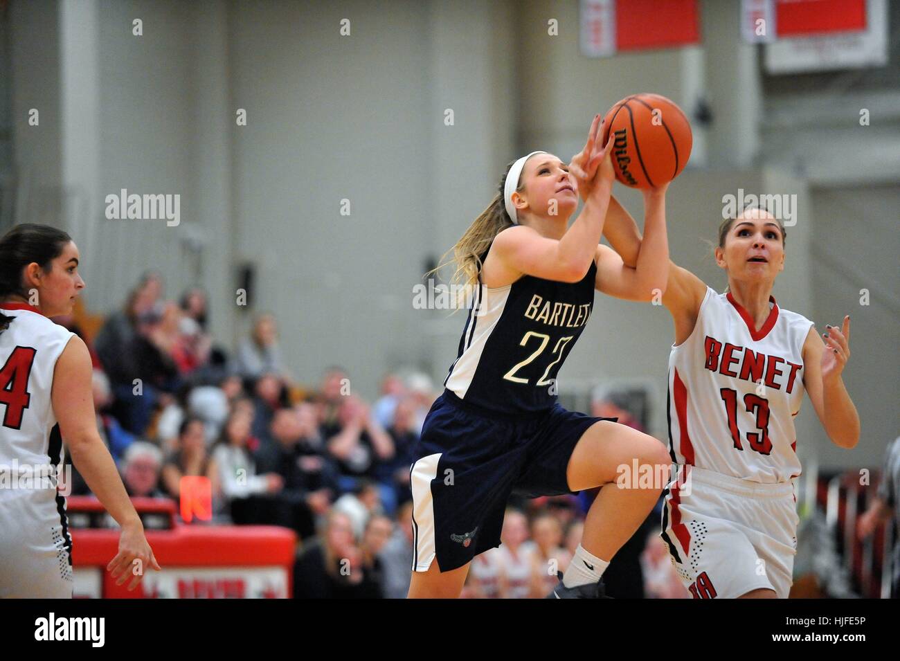 High school player finishing off a drive by taking a shot while being ...