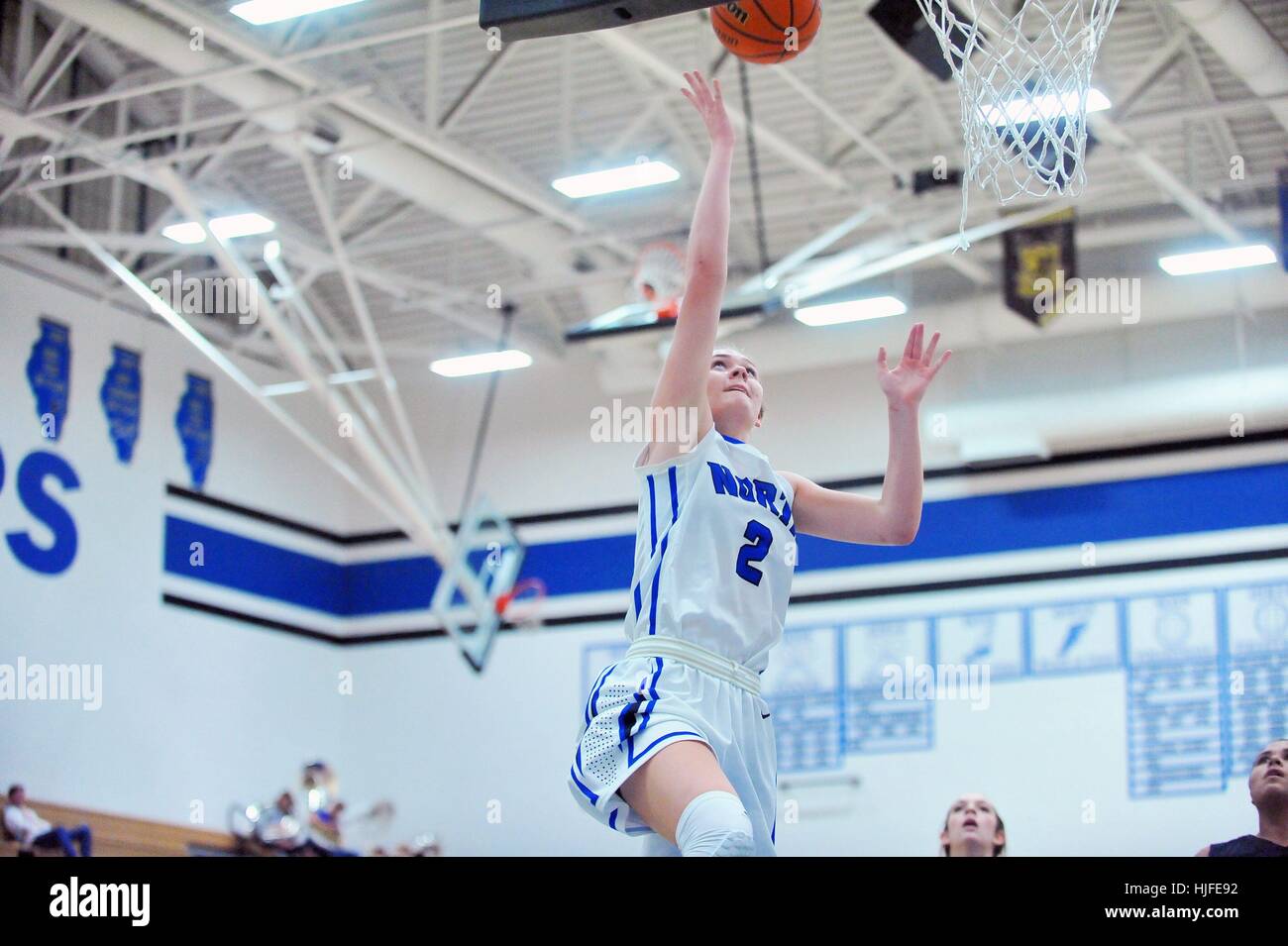 Player laying up two points to extend her team's lead late in a high ...