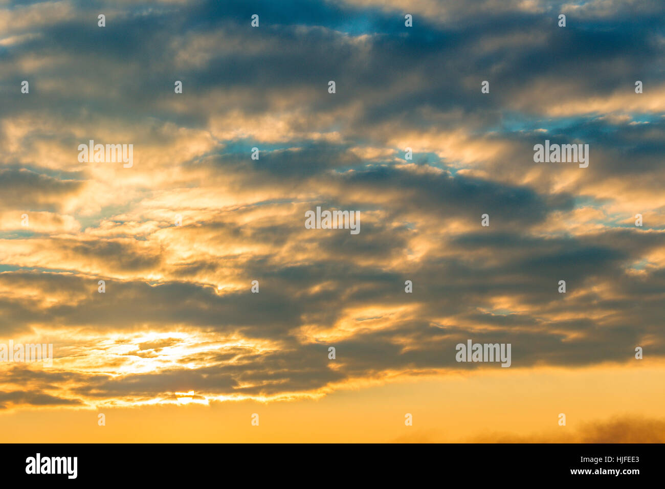 clouds of golden winter sunrise Stock Photo - Alamy