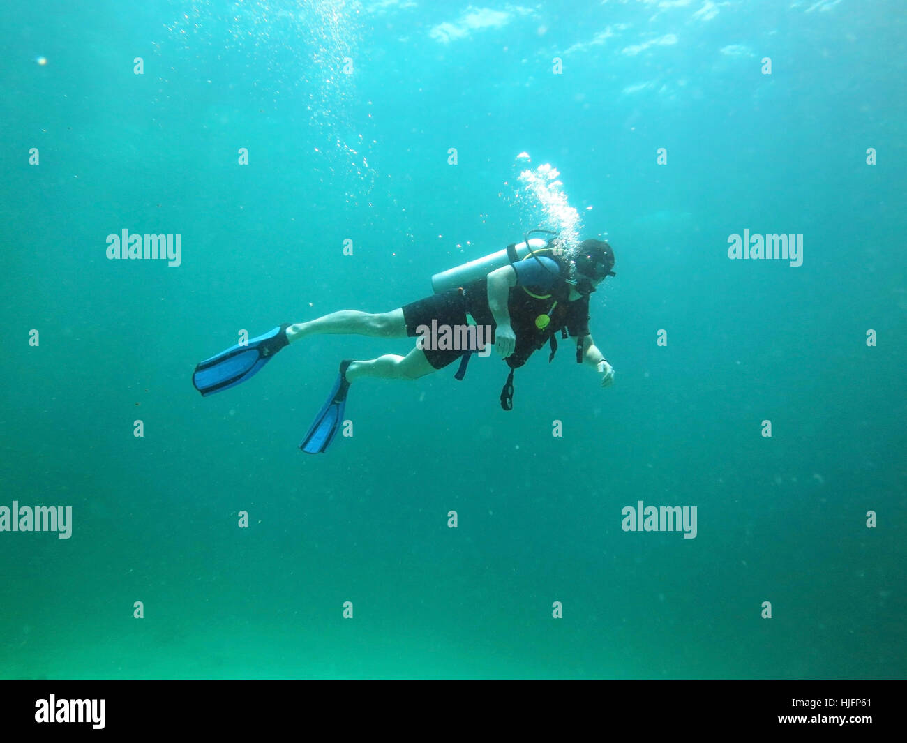 Young Man Scuba Diver between Water Surface Stock Photo - Alamy