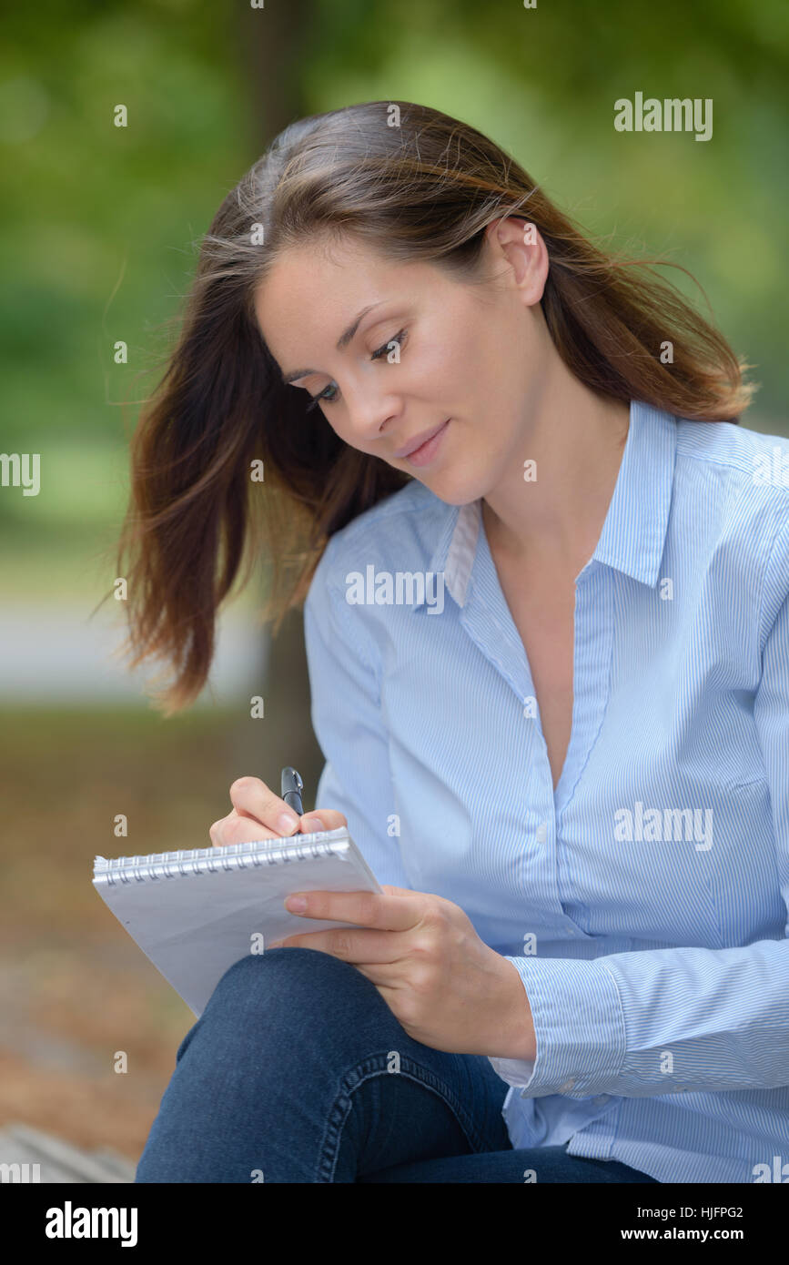writing a letter in the park Stock Photo - Alamy