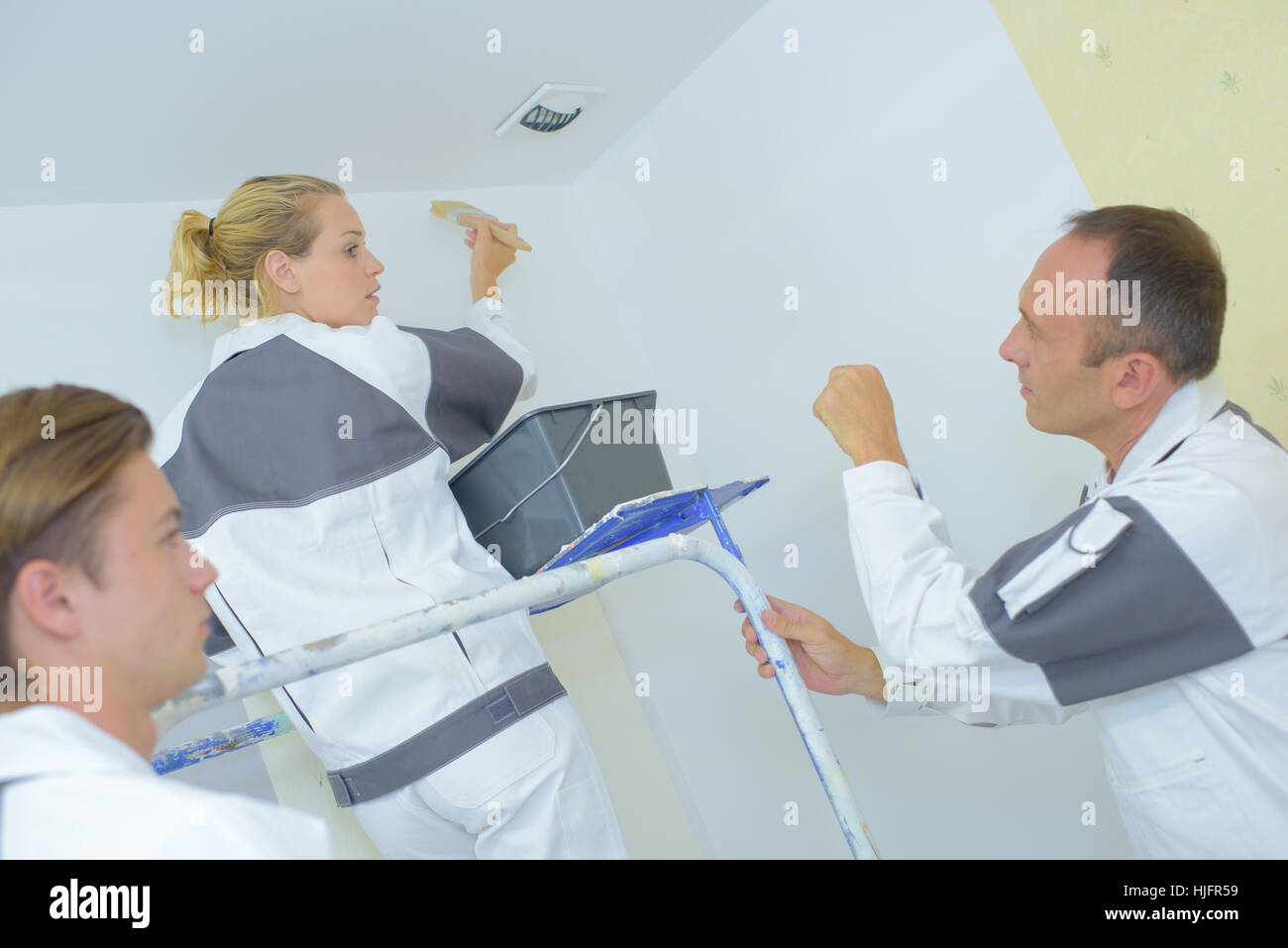 Female apprentice painter at work Stock Photo - Alamy