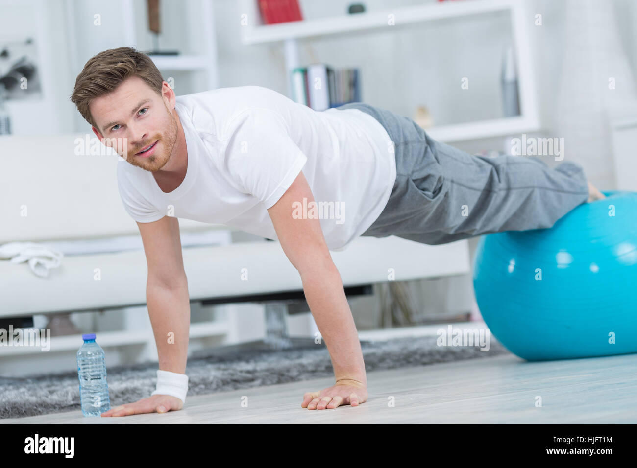 active strong man having hard training at home Stock Photo - Alamy