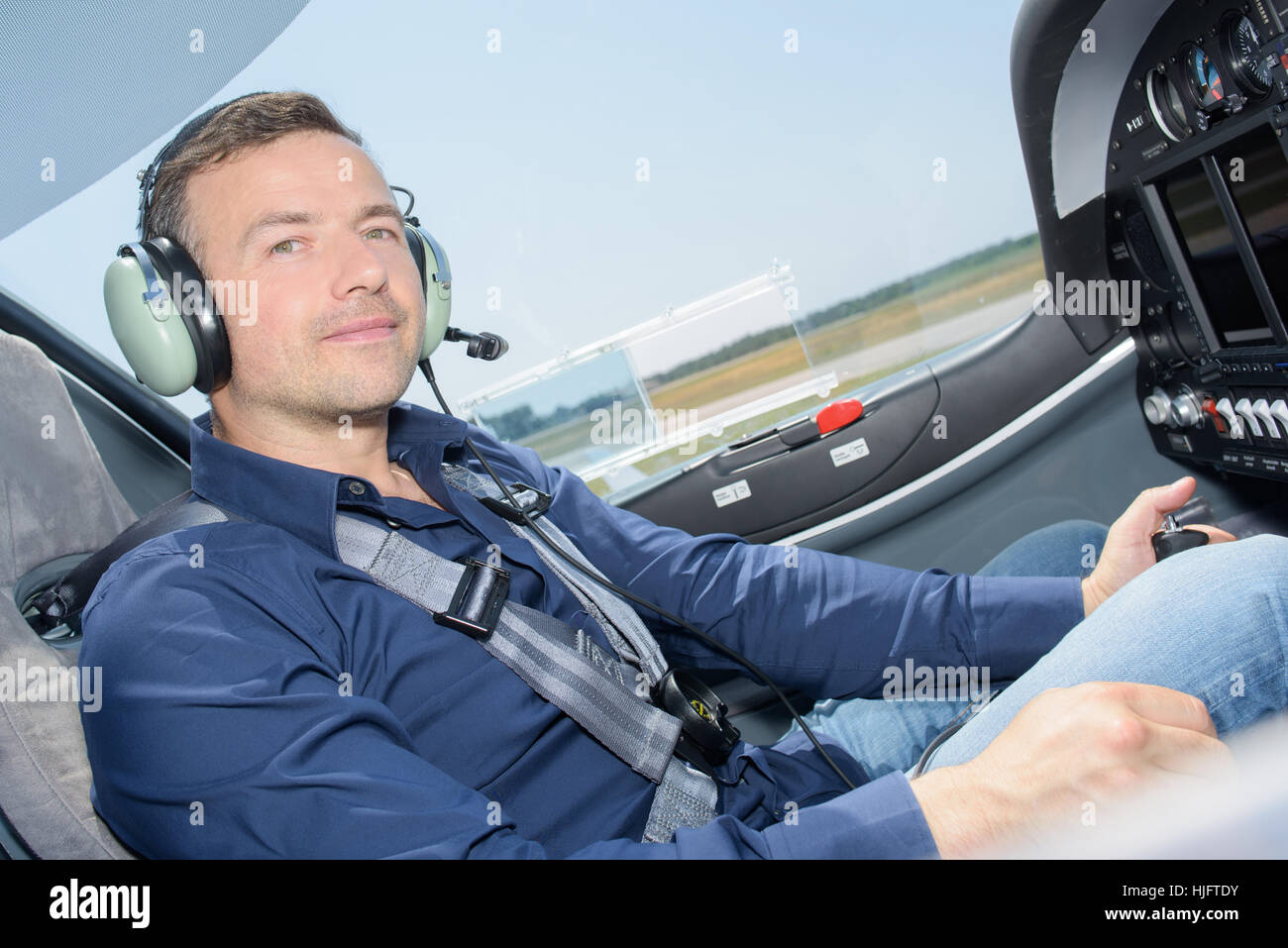 Portrait of man in cockpit of plane Stock Photo - Alamy
