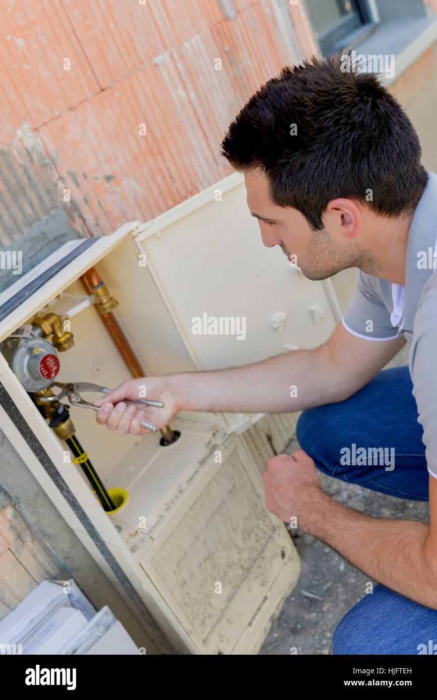 Fixing the water meter Stock Photo - Alamy