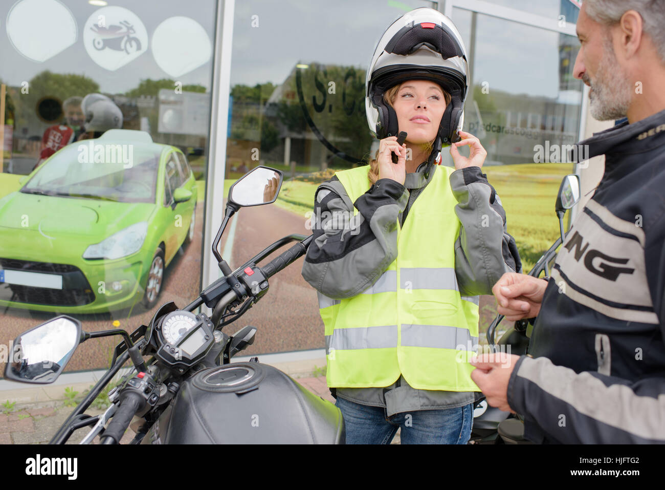 putting on the helmet Stock Photo - Alamy