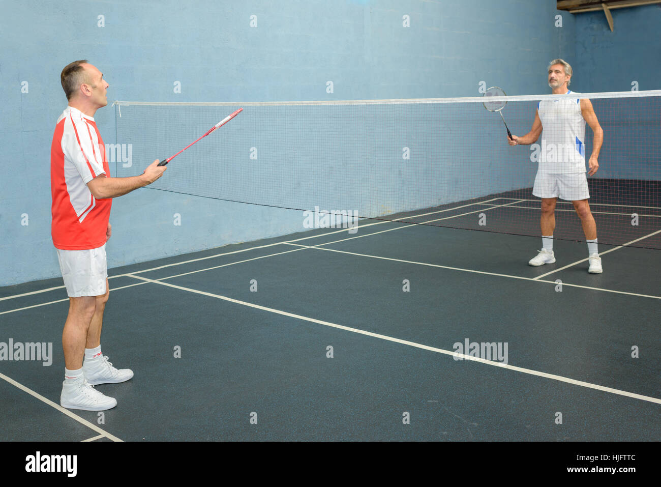Men playing badminton Stock Photo - Alamy