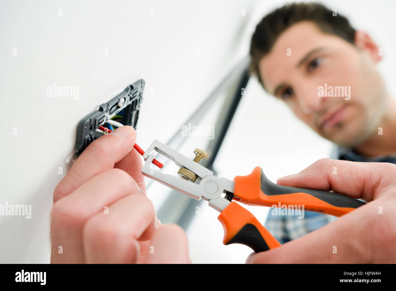 electrician fitting socket Stock Photo - Alamy