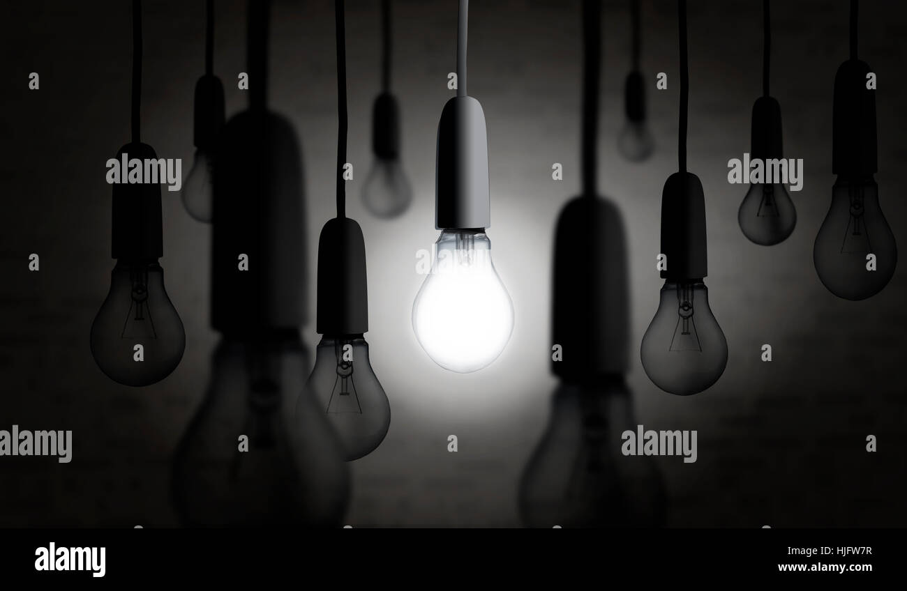 Light bulb lighting up in the dark Stock Photo - Alamy