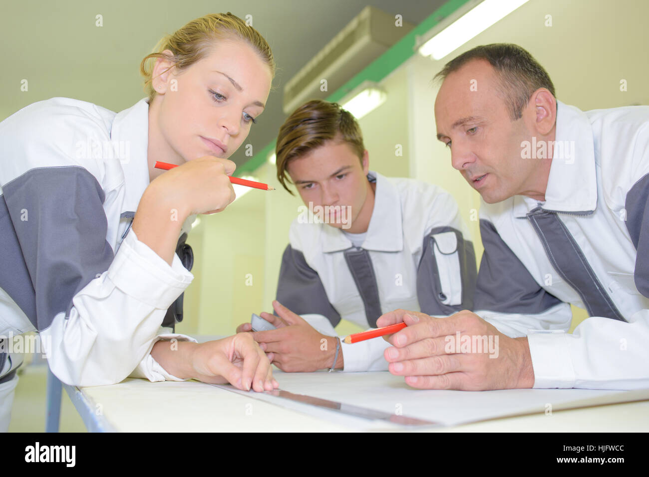 Team of decorators at work Stock Photo - Alamy