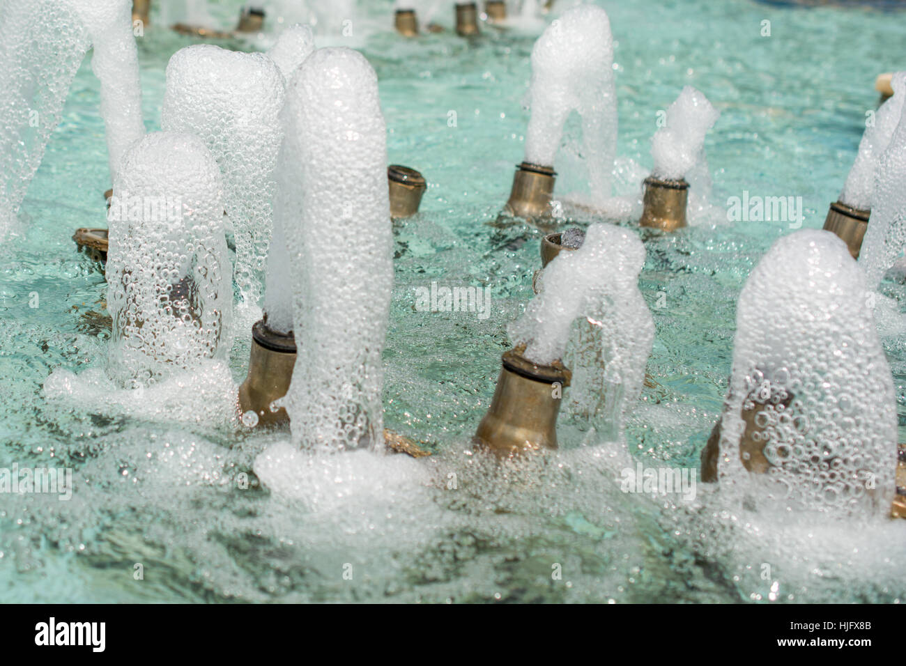 The fountains gushing sparkling water in a pool in a park Stock Photo ...